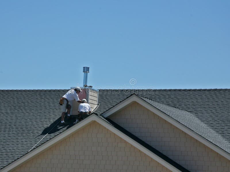 Men Working on Roof stock image. Image of construction - 896927