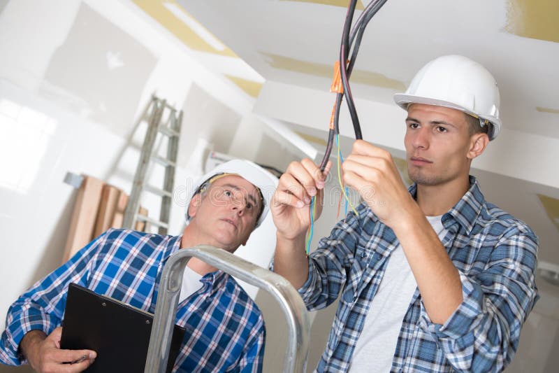 Men Working on Solving Cabling Problem Stock Photo - Image of employee ...