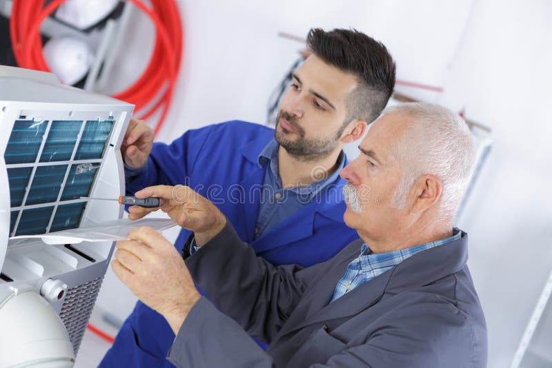 Men Working on Ventilation System Stock Image - Image of people ...