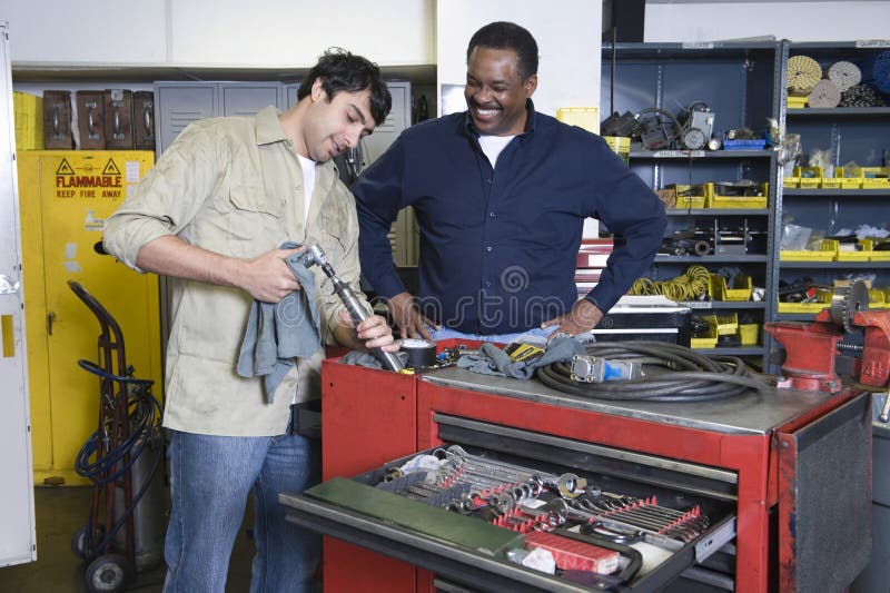 Men in Workshop with Tools stock image. Image of profession - 33910299