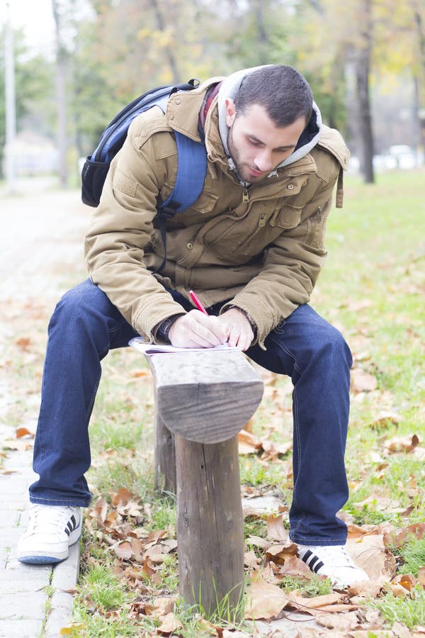 Men Writing in His Notebook Stock Image - Image of college, adult: 46110095
