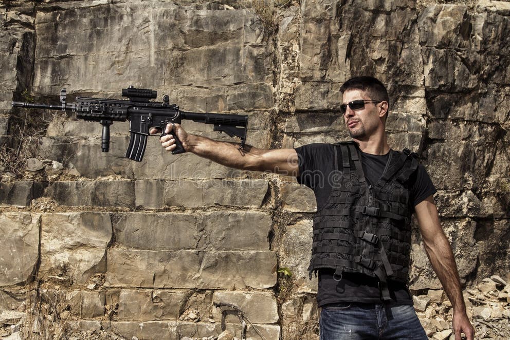 Menacing Man Pointing a Machine Gun Stock Photo - Image of violence ...