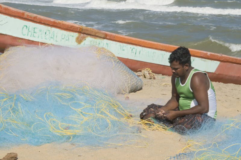 Fishermen preparing nets editorial stock image. Image of fisherman ...