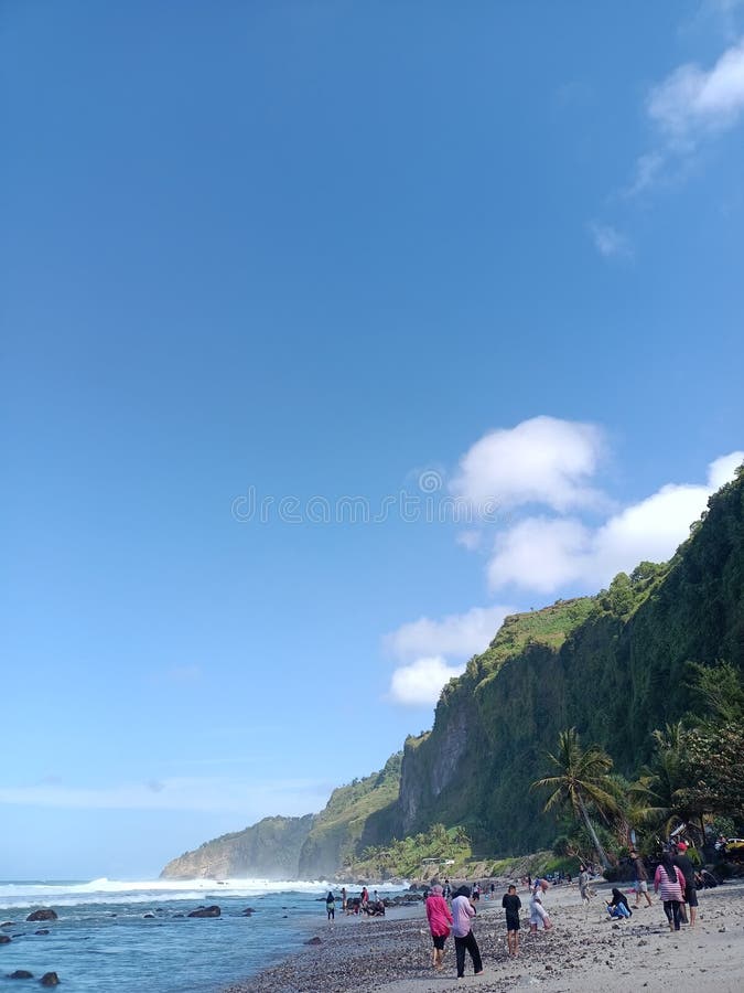 Menganti Beach, Indonesia editorial stock image. Image of cliff - 266533109