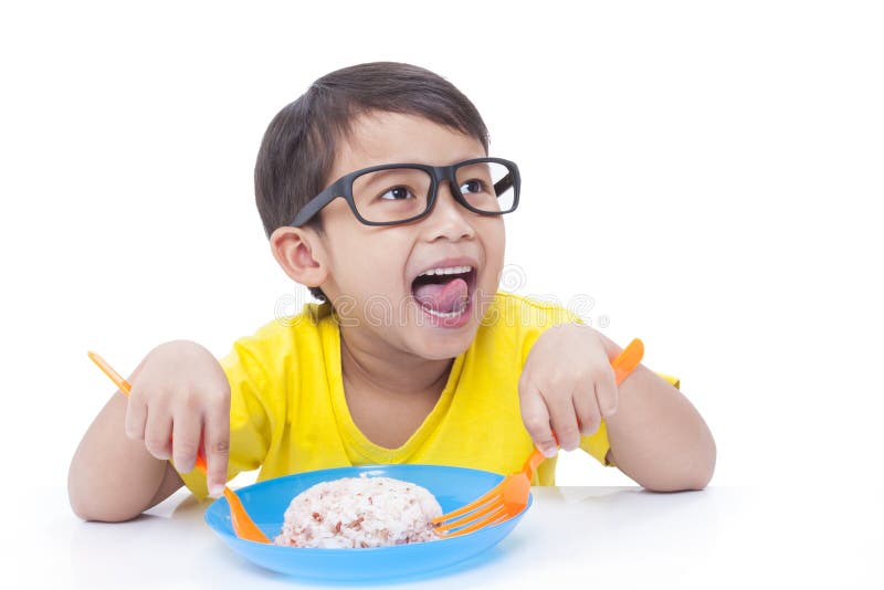 Menino que come o arroz imagem de stock. Imagem de alegria - 47643037