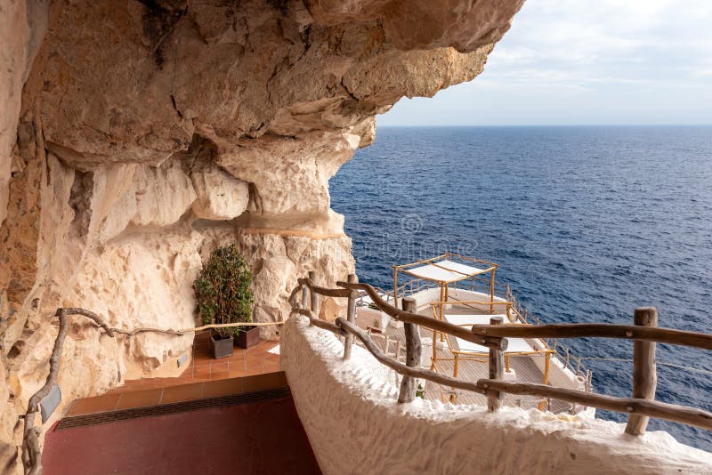 Seaside Cafe Bar in the Caves on the Island of Menorca, Spain Editorial ...
