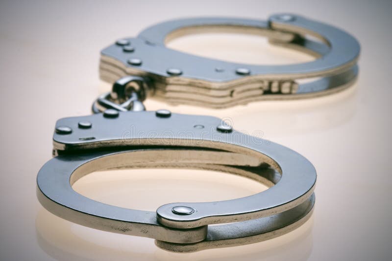 Menottes photo stock. Image du main, arrêté, application - 1420630