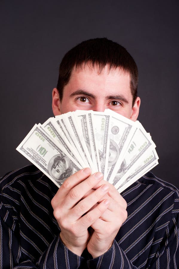 Mens met het geld stock foto. Image of gelukkig, ventilator - 17530410