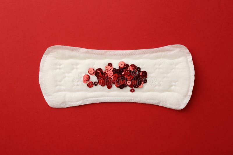 Menstrual Pad with Sequins on Red Background, Top View Stock Image ...