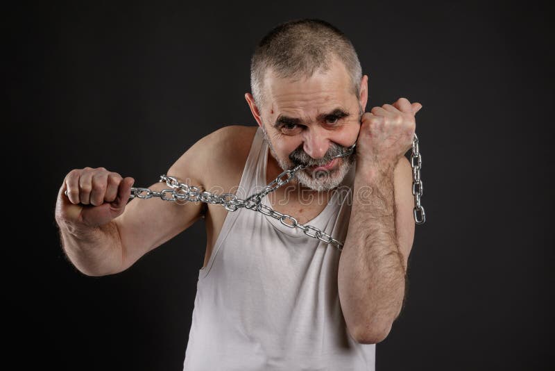 Mentally insane man stock image. Image of chains, crazy - 68219549