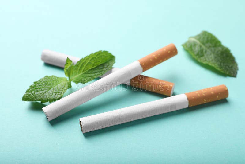 Menthol Cigarettes and Mint on Turquoise Background Stock Photo - Image ...