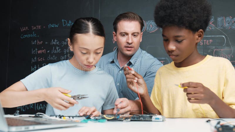 Mentor Talk about Electric Tool while Student Fixing Robotic Model ...