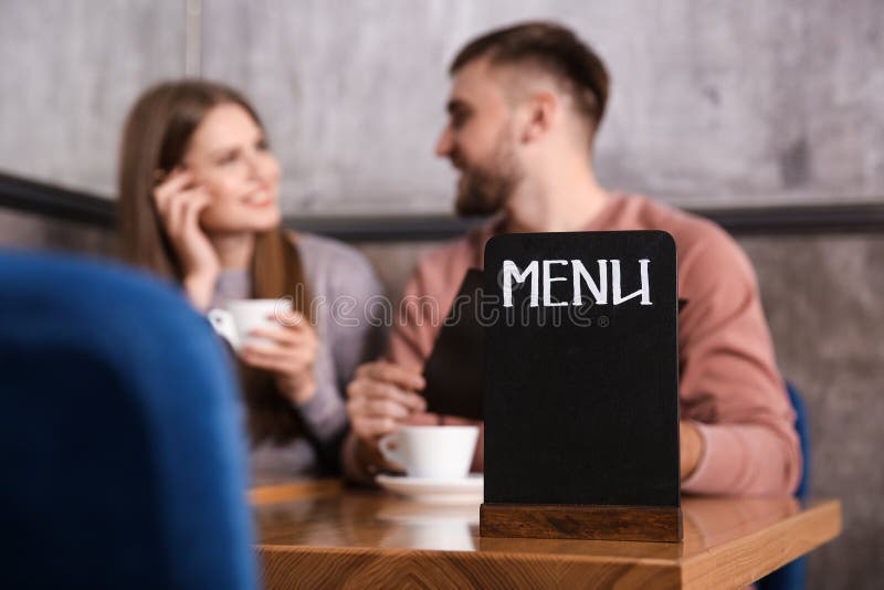 Menu Board on Wooden Table of Young Couple in Restaurant Stock Image ...