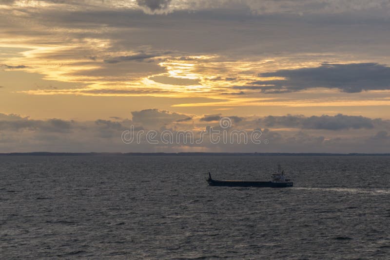 Merchant Ship in the North Sea at Sunset Stock Image - Image of ship ...