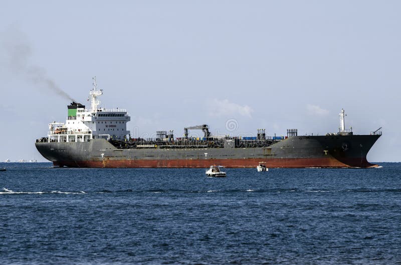 Merchant ship at sea stock image. Image of ship, travel - 115301037
