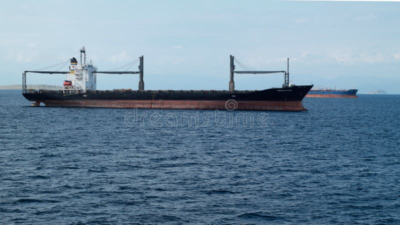 Merchant Vessels and Cargo Container Ships Entering the Port Editorial ...