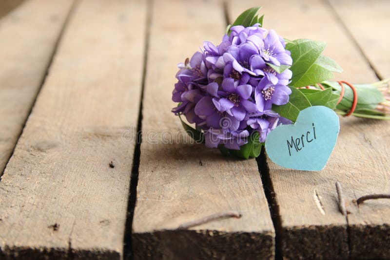 Merci Written on Tag and Flowers Stock Photo - Image of thankful ...