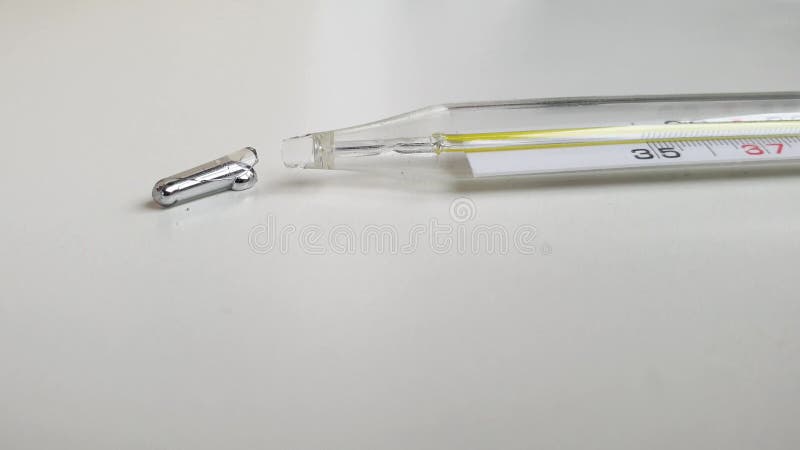 Mercury Thermometer Broken, Close-up on White Background. Remove ...