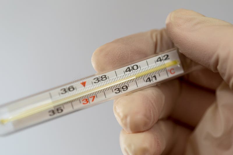 High Body Temperature Mercury Thermometer In The Hands Of A Nurse