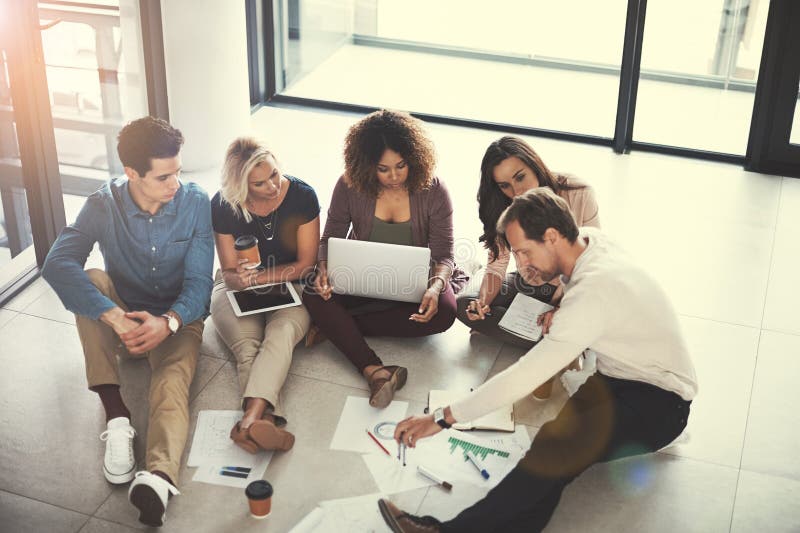 Merging Their Creative Input. a Team of Designers Brainstorming on the ...