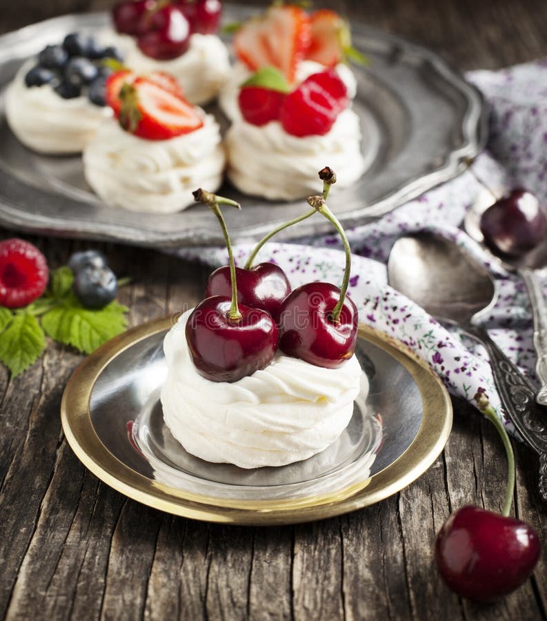 Meringue Nests Topped with Whipped Cream with Berries Stock Image ...