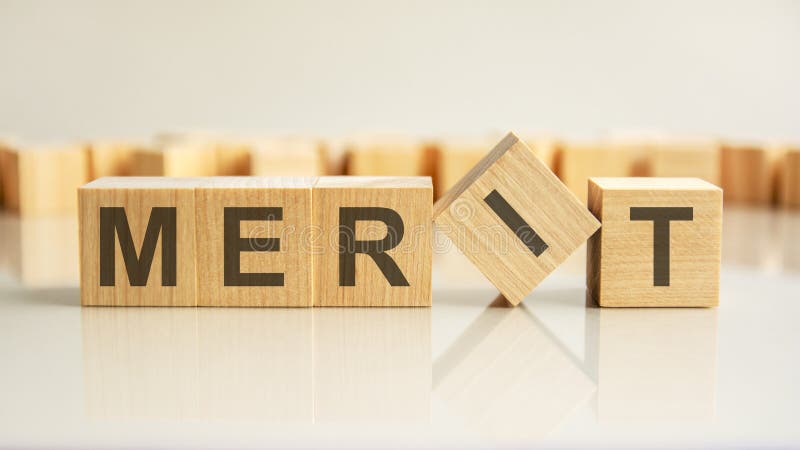 Merit Text on a Wooden Blocks, Gray Background. Stock Image - Image of ...