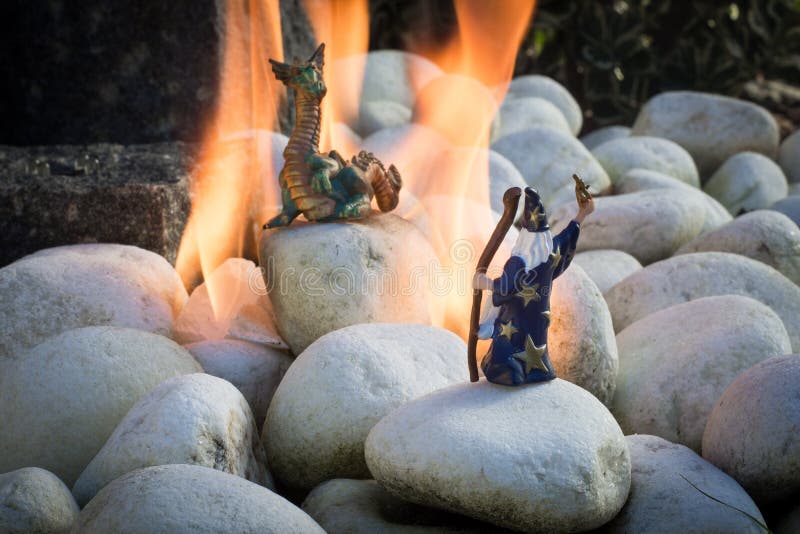 Merlin Doing Fire Magic on Dragon Stock Photo - Image of fire, minature ...