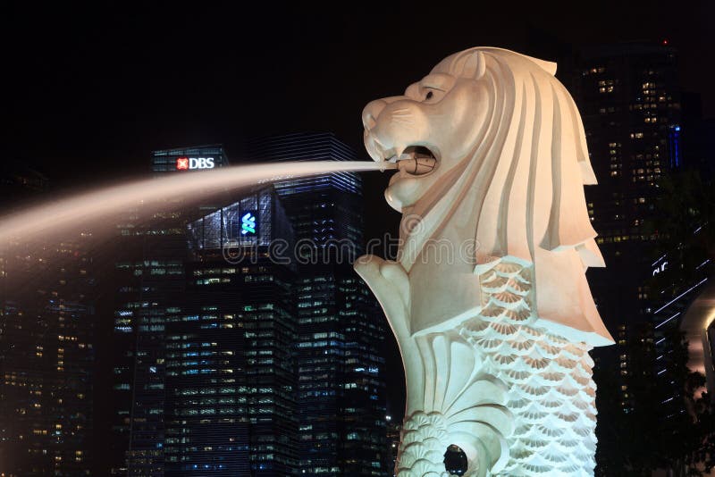The Merlion Statue in Front of Singapore Skyline at Night Editorial ...
