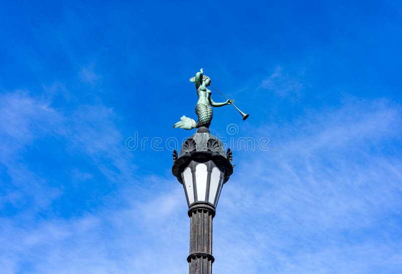 Mermaid Sculpture on a Street Lamp Stock Photo - Image of blue ...