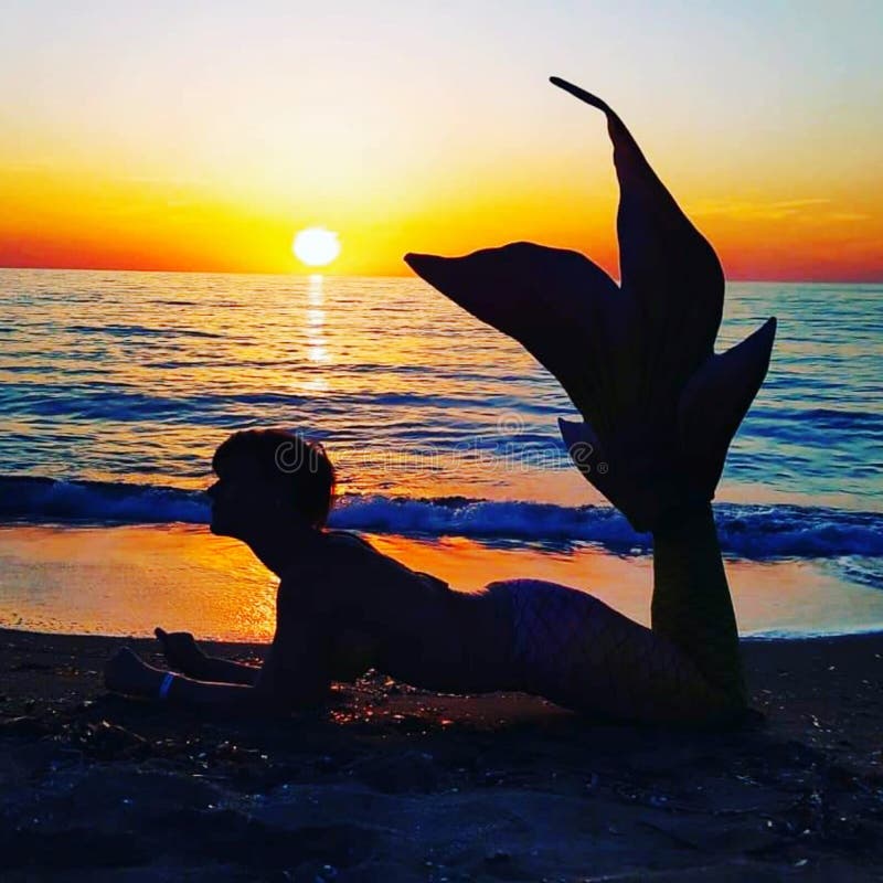 Mermaid at sunset stock photo. Image of island, girl - 50753922