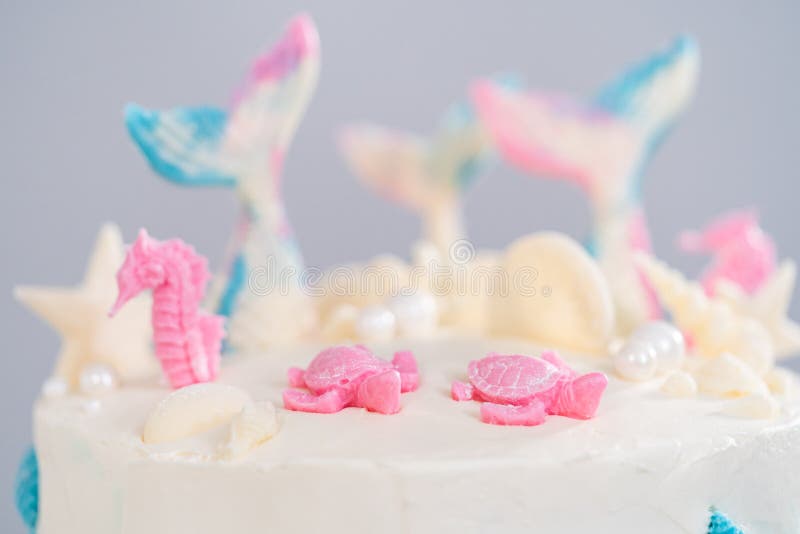 Vanilla Cake Decorated with Chocolate Mermaid Tails and Seashells on a ...
