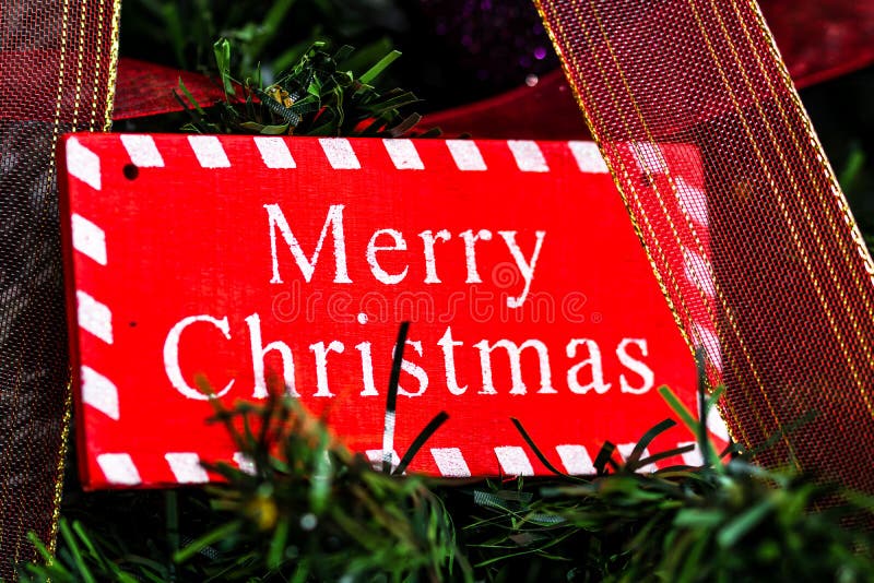 Merry Christmas Sign Hanging in the Christmas Tree Stock Photo - Image ...