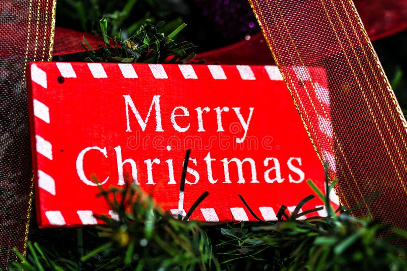 Merry Christmas Sign Hanging in the Christmas Tree Stock Photo - Image ...