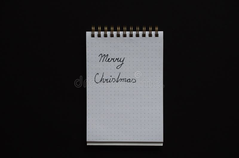 Merry Christmas Write in Notepad with Black Background Stock Photo ...