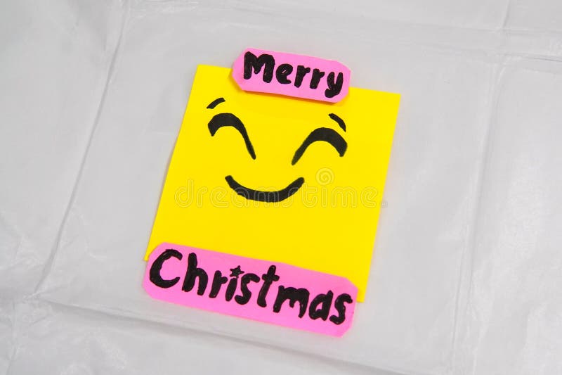 Merry Christmas! Write on Sticky Notes with Happy Face Stock Photo ...