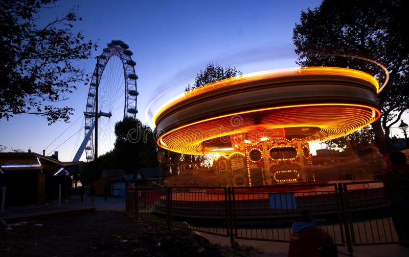 Merry Go Round and London Eye Editorial Photography - Image of carousel ...