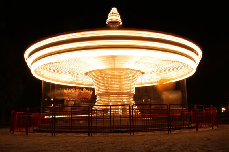 Merry-Go-Round in Motion Illuminated at Night Stock Photo - Image of ...