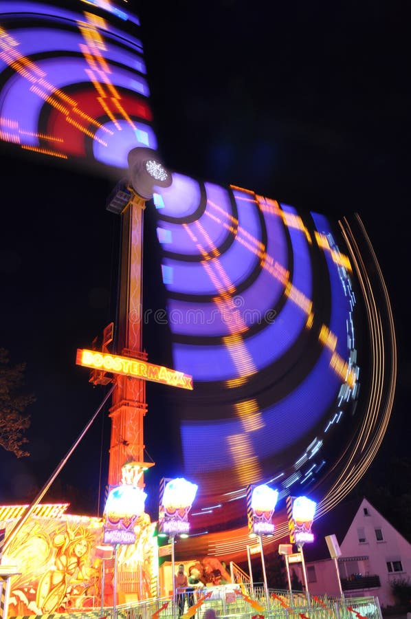 Merry-go-round at night stock photo. Image of vomax, rotating - 56106728