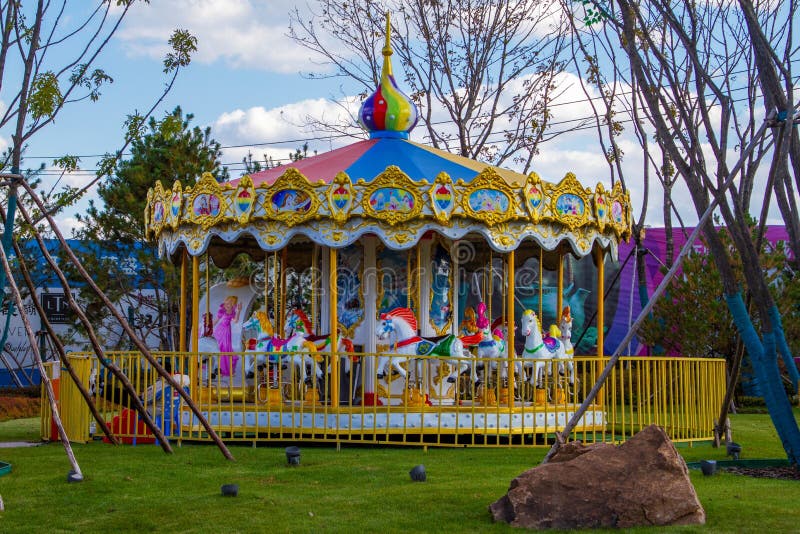 A Merry-go-round Playground in a Park Editorial Stock Photo - Image of ...