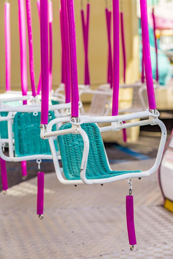 Merry-go-round seats stock photo. Image of empty, chain - 70099428