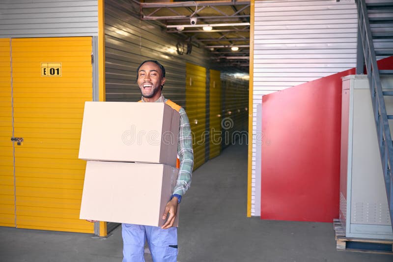 Cheerful Freight Handler Posing for Camera at Work in Warehouse Stock ...