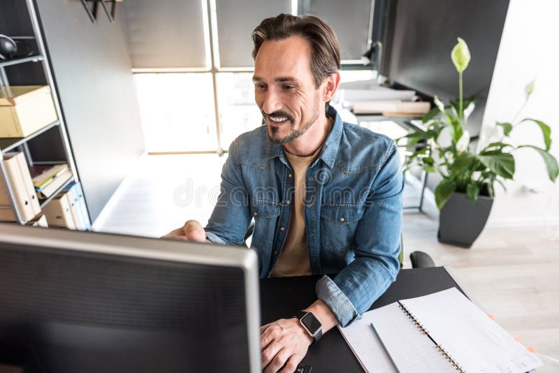 Merry Smiling Man Using Laptop for Work Stock Image - Image of ...