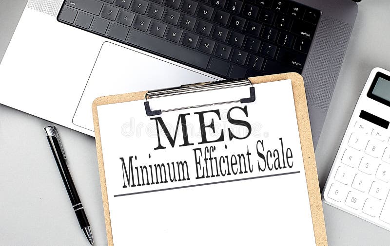 MES Minimum Efficient Scale Written on Clipboard with Laptop and ...