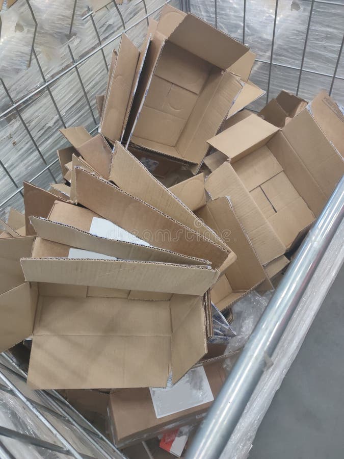Mesh Metal Container with Empty Cardboard Boxes Stock Photo - Image of ...