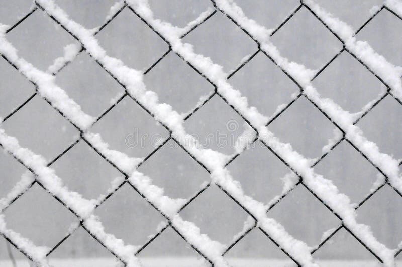 Mesh netting in the snow stock photo. Image of brickwork - 207638300