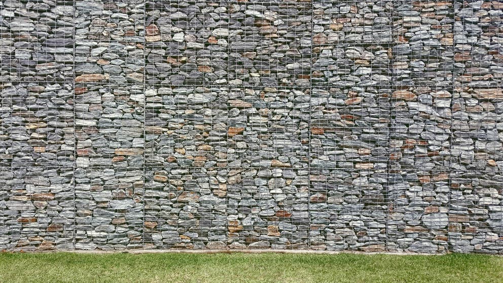 Mesh Stone Wall and Grass in the Front Stock Photo - Image of netting ...