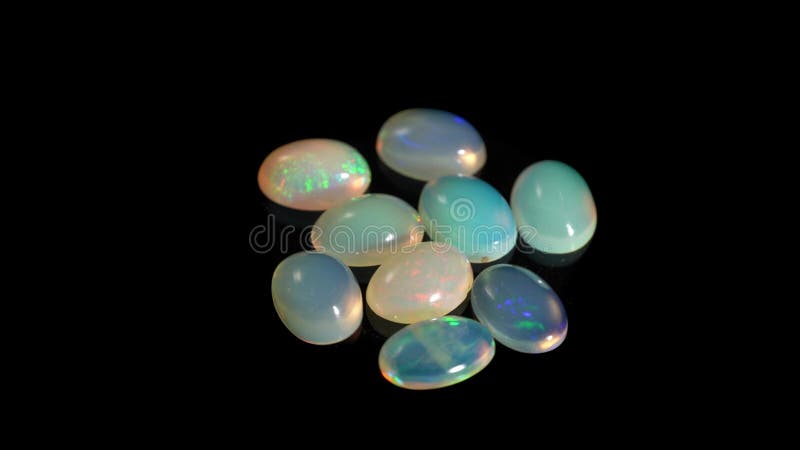 Mesmerizing Composition of Iridescent Opal Gemstones on a Black ...