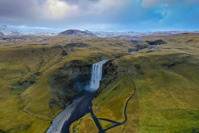 Mesmerizing Aerial View of Skogafoss Waterfall Captured on a Cloudy Day ...