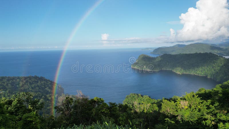 Mesmerizing Landscape of a Tropical Lush-forested Island Under a Double ...