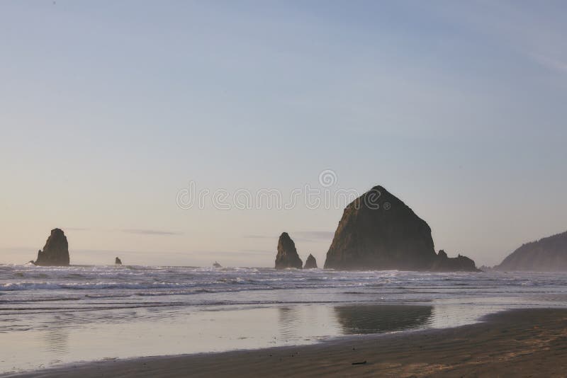 Mesmerizing Scenery of Sunset at Haystack Rock at the Pacific Ocean ...